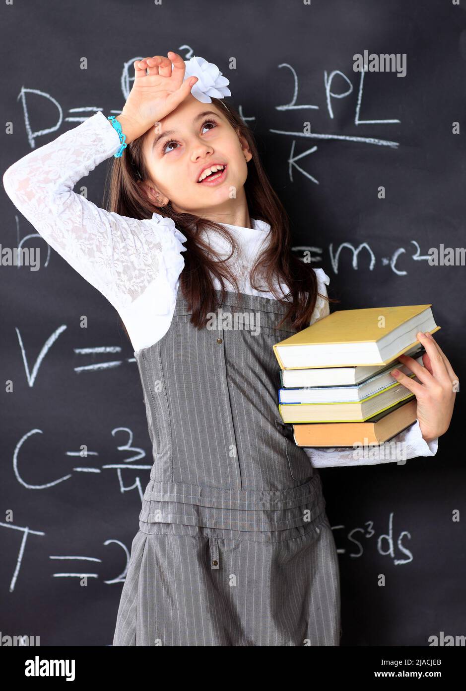 The little girl decides to mathematical equations Stock Photo - Alamy