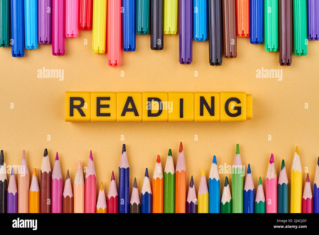 The word reading written on yellow cubes. Flat lay composition with ...