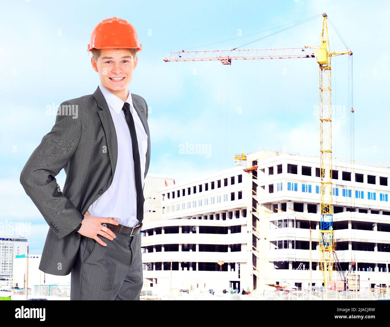 Engineer With Red Hard Hat and Blueprint Under the Power Lines.Engineer ...