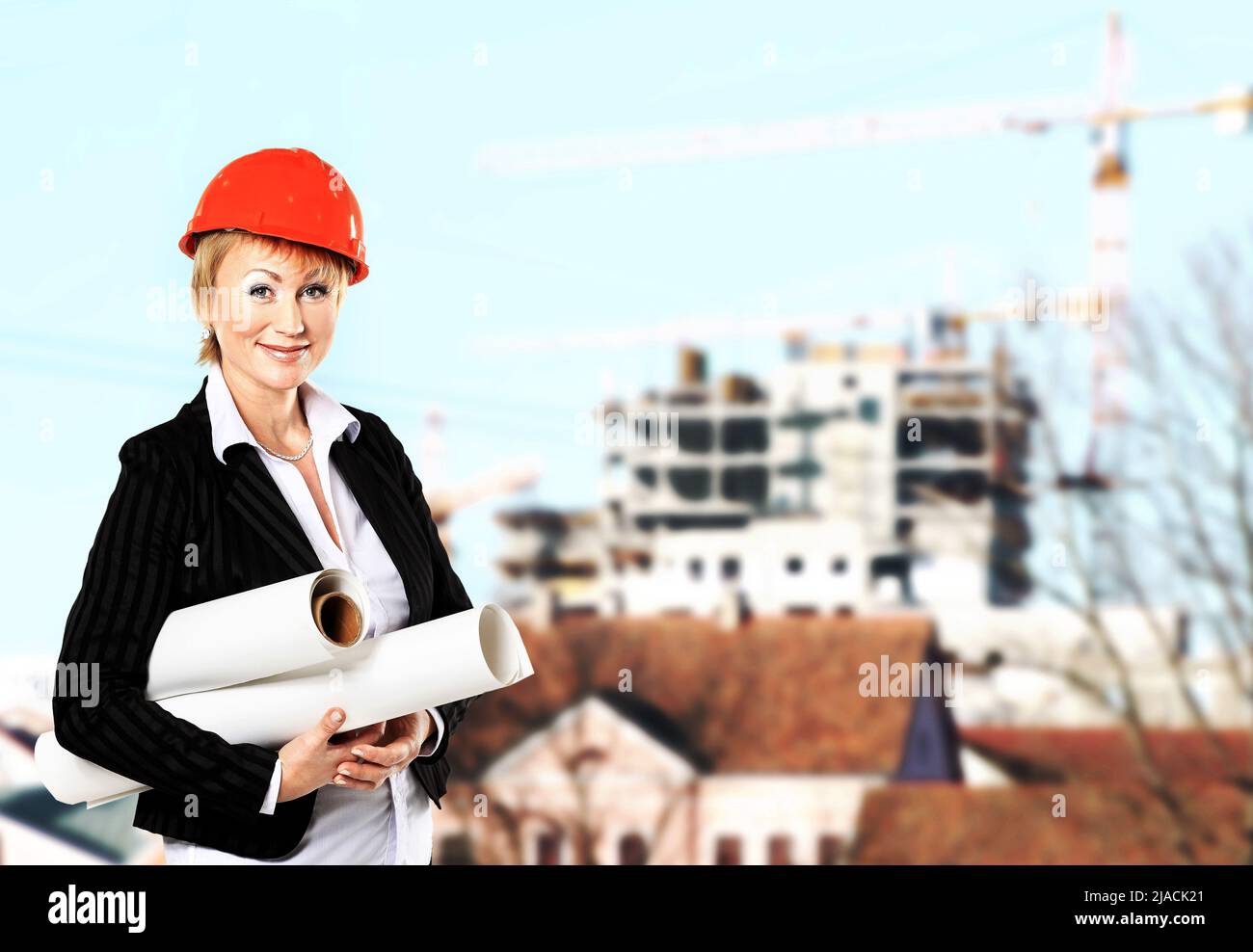 Female architect holding blueprints Stock Photo - Alamy