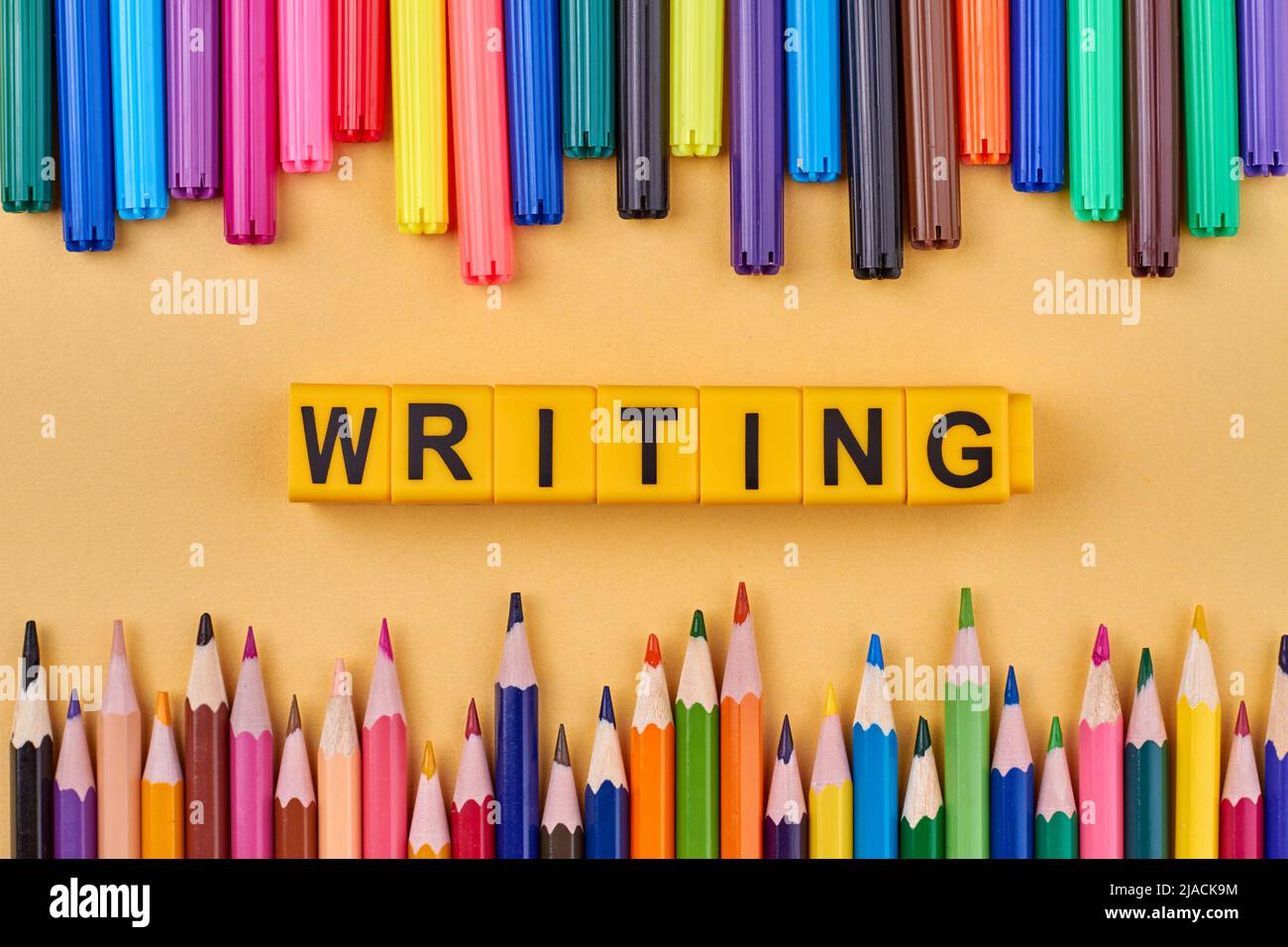 Flat lay composition with word writing written on yellow cubes and ...