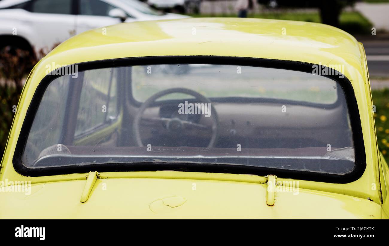 rear window of old retro automobile. vintage yellow car Stock Photo - Alamy