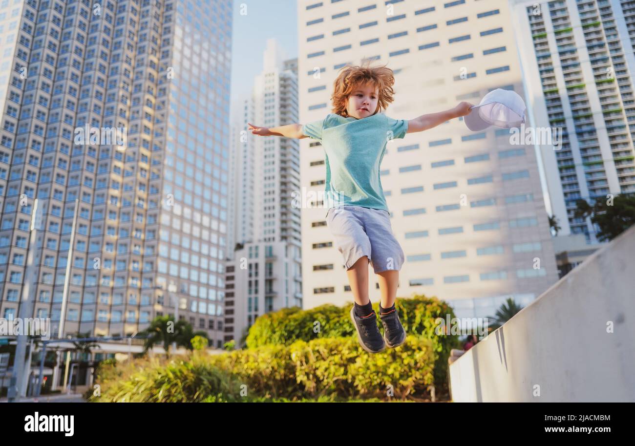 Future city concept. Child and modern buildings. Kid in town skyscraper ...
