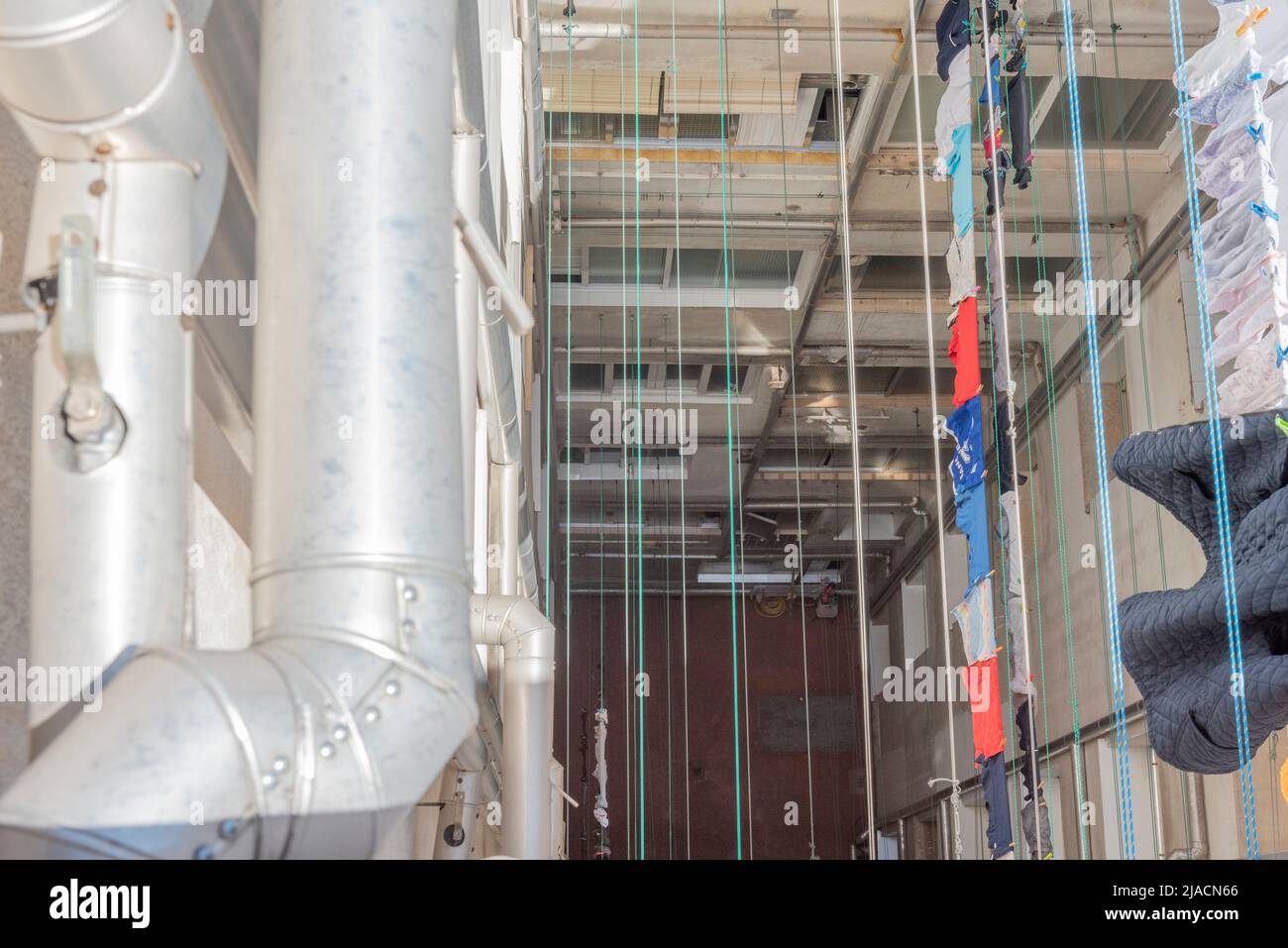 Clothes lines in the interior courtyard of a residential apartment ...