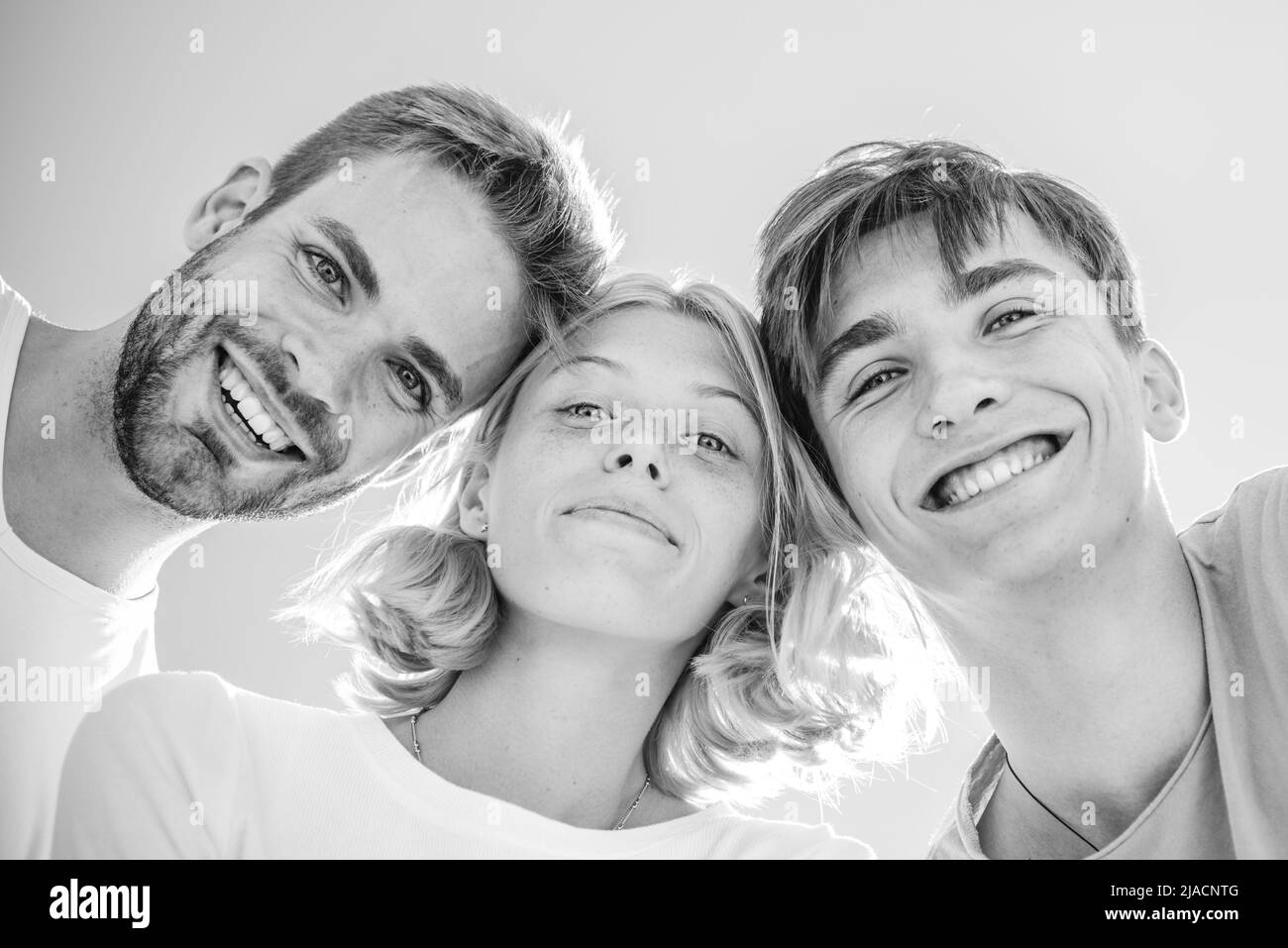 Young man group friends outside Black and White Stock Photos & Images ...