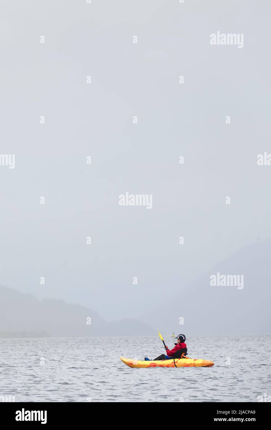 Blue and yellow kayak on open water at Loch Lomond Stock Photo - Alamy