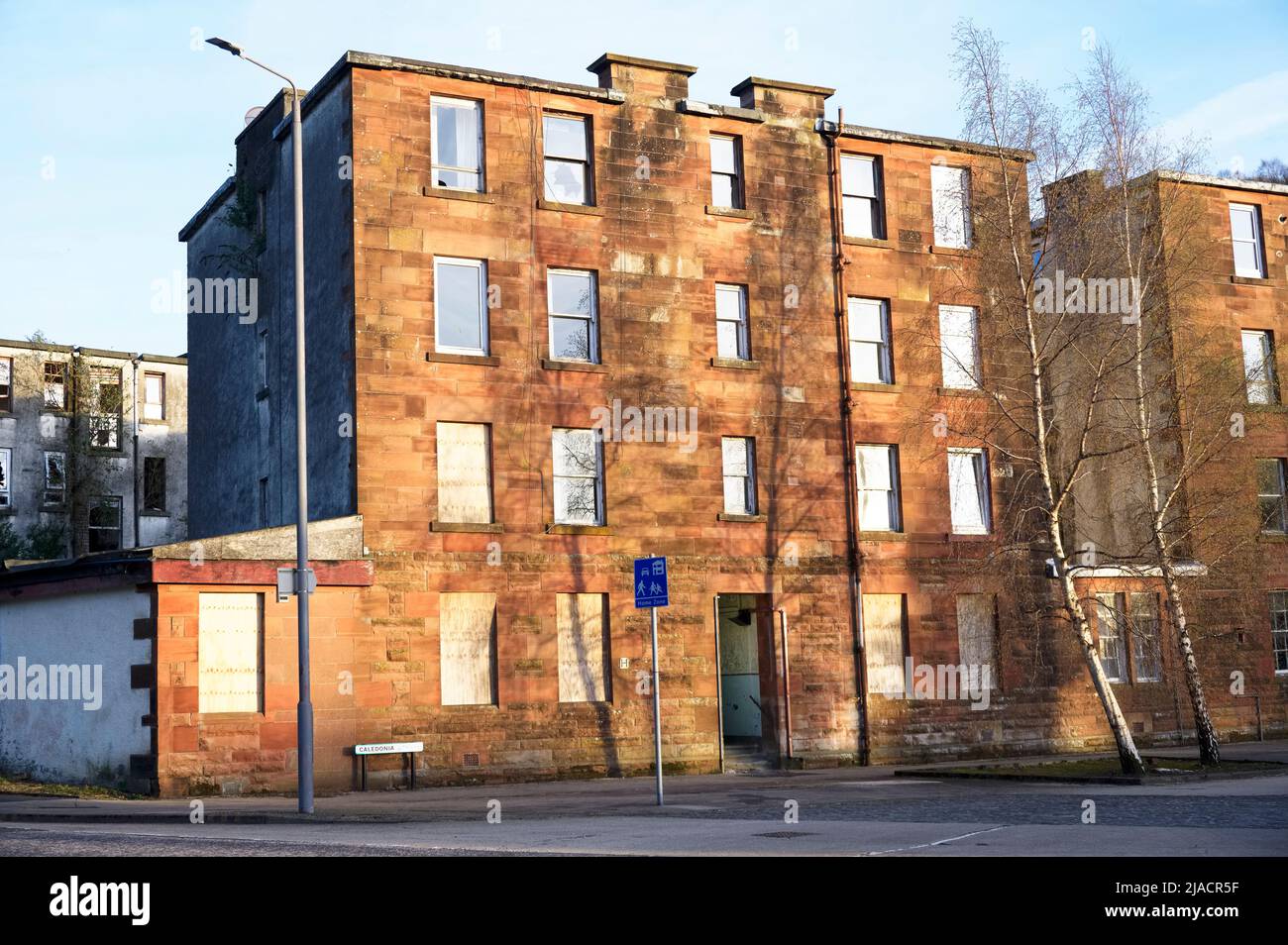 Derelict council house in poor housing estate slum with many social ...