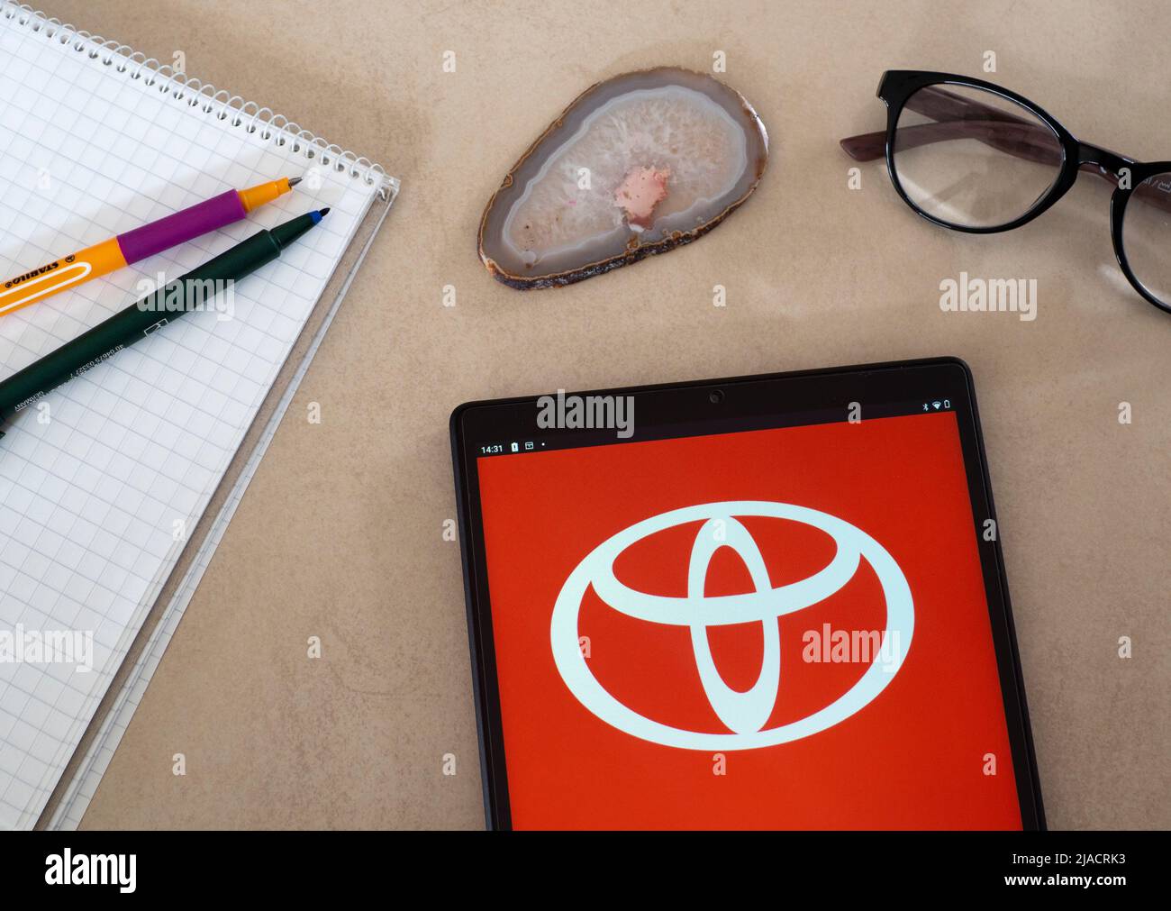 In this photo illustration, a Toyota Motor Corporation logo seen ...