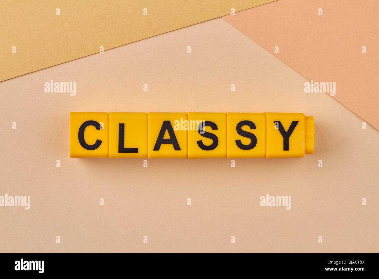 Word classy written on yellow blocks against color background. Style ...