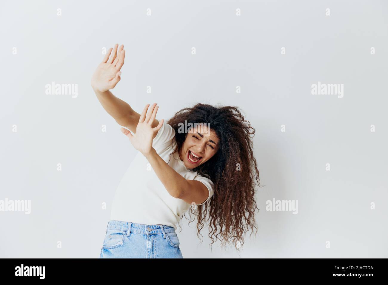 STOP ABUSE VICTIM CONCEPT. Scared beautiful Latin female with afro ...