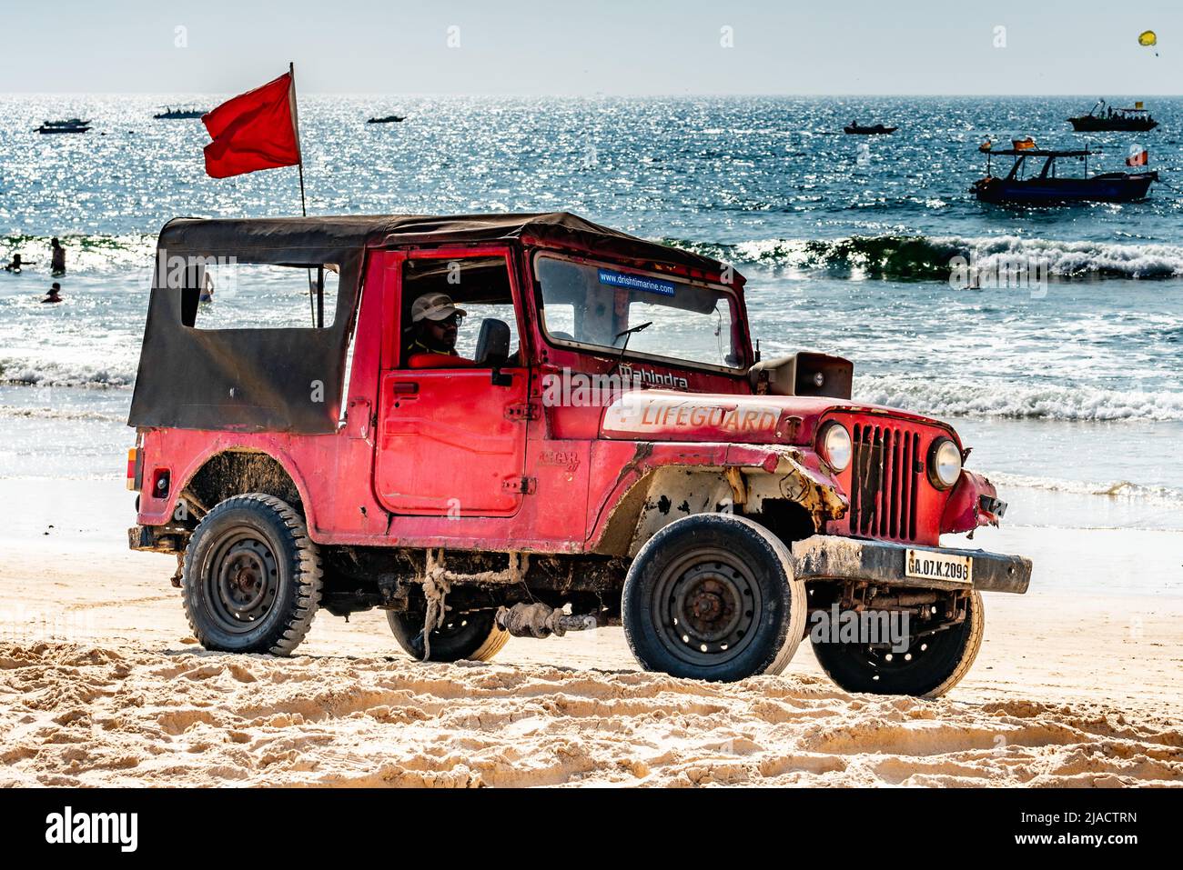 Very old roasty off road car 4x4, beach lifeguards on tropical beach ...
