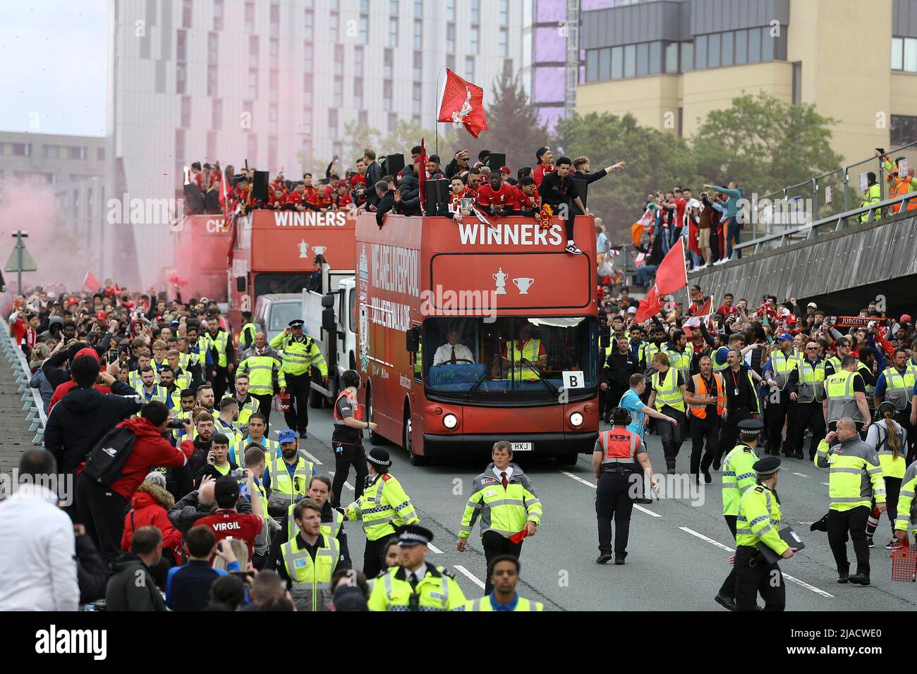 Liverpool, UK. 29th May, 2022. Liverpool fans greet the team busses ...