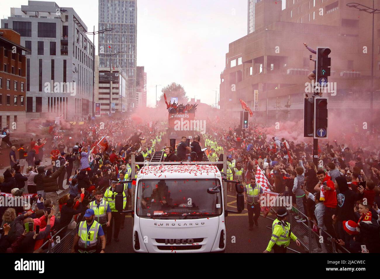 Liverpool, UK. 29th May, 2022. Fans greet the team bus along the Strand ...