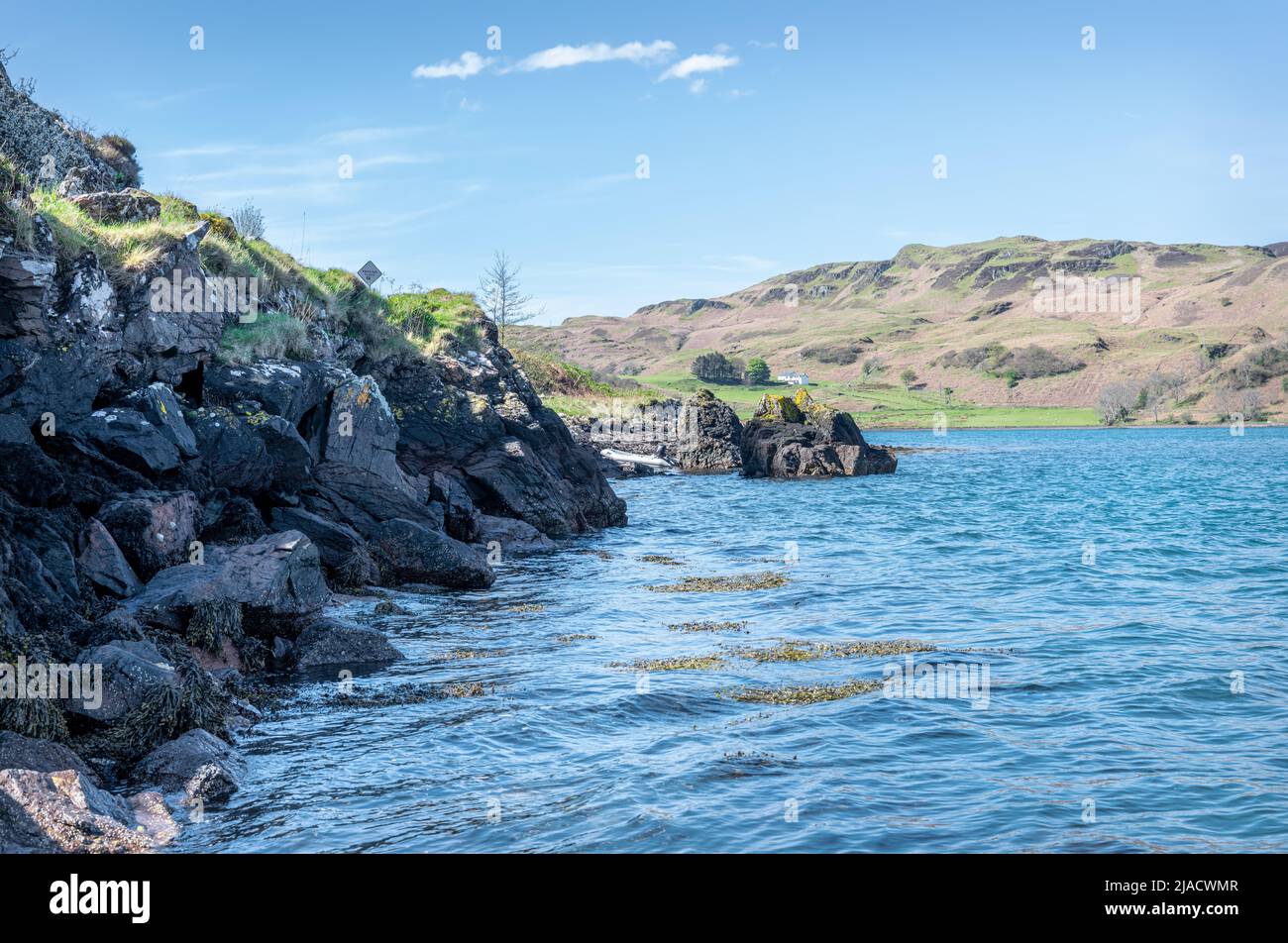 Rocky Sea shore south of Oban at the Kerrera Ferry Slipway with the ...