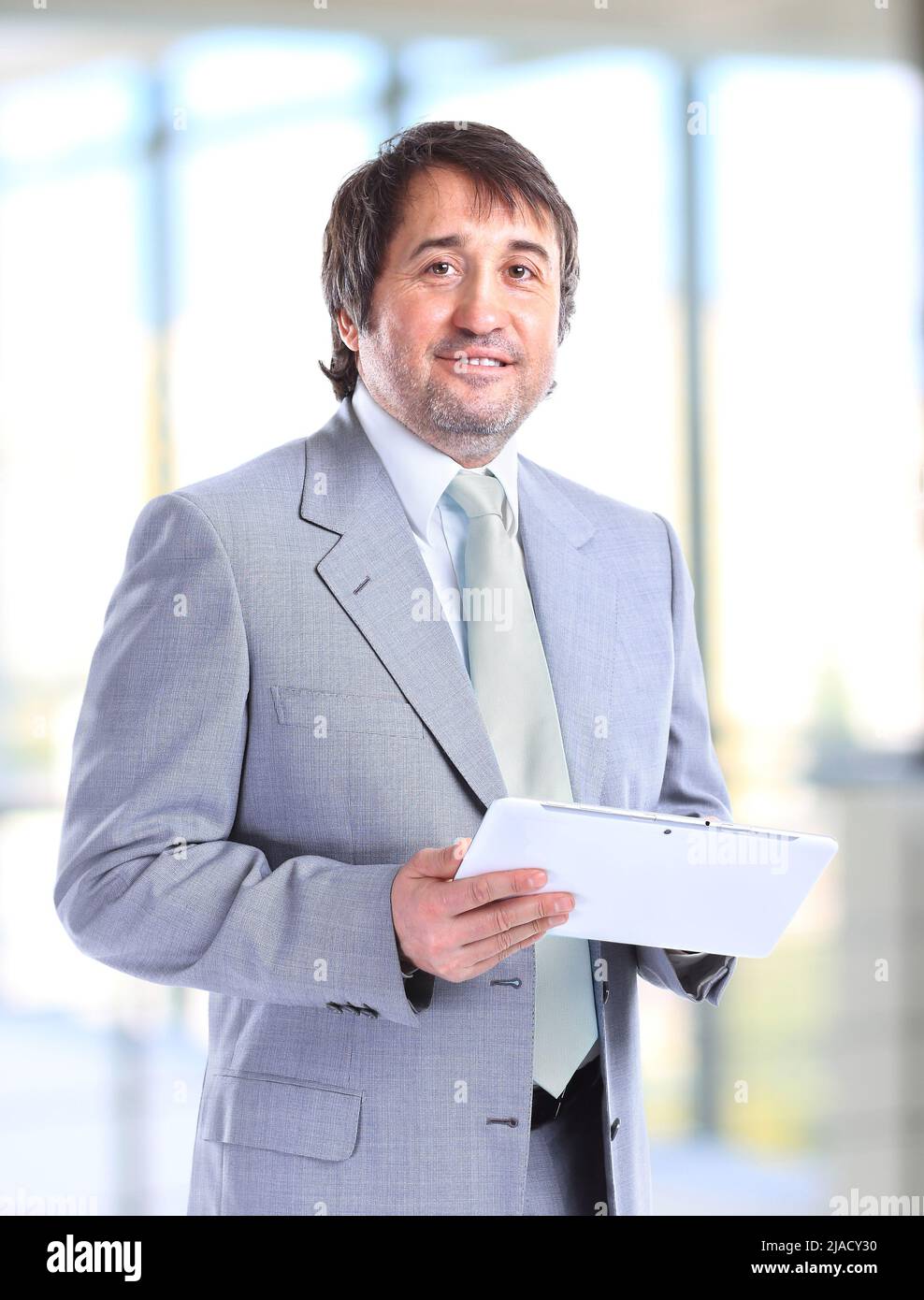Happy smiling businessman tablet hi-res stock photography and images ...