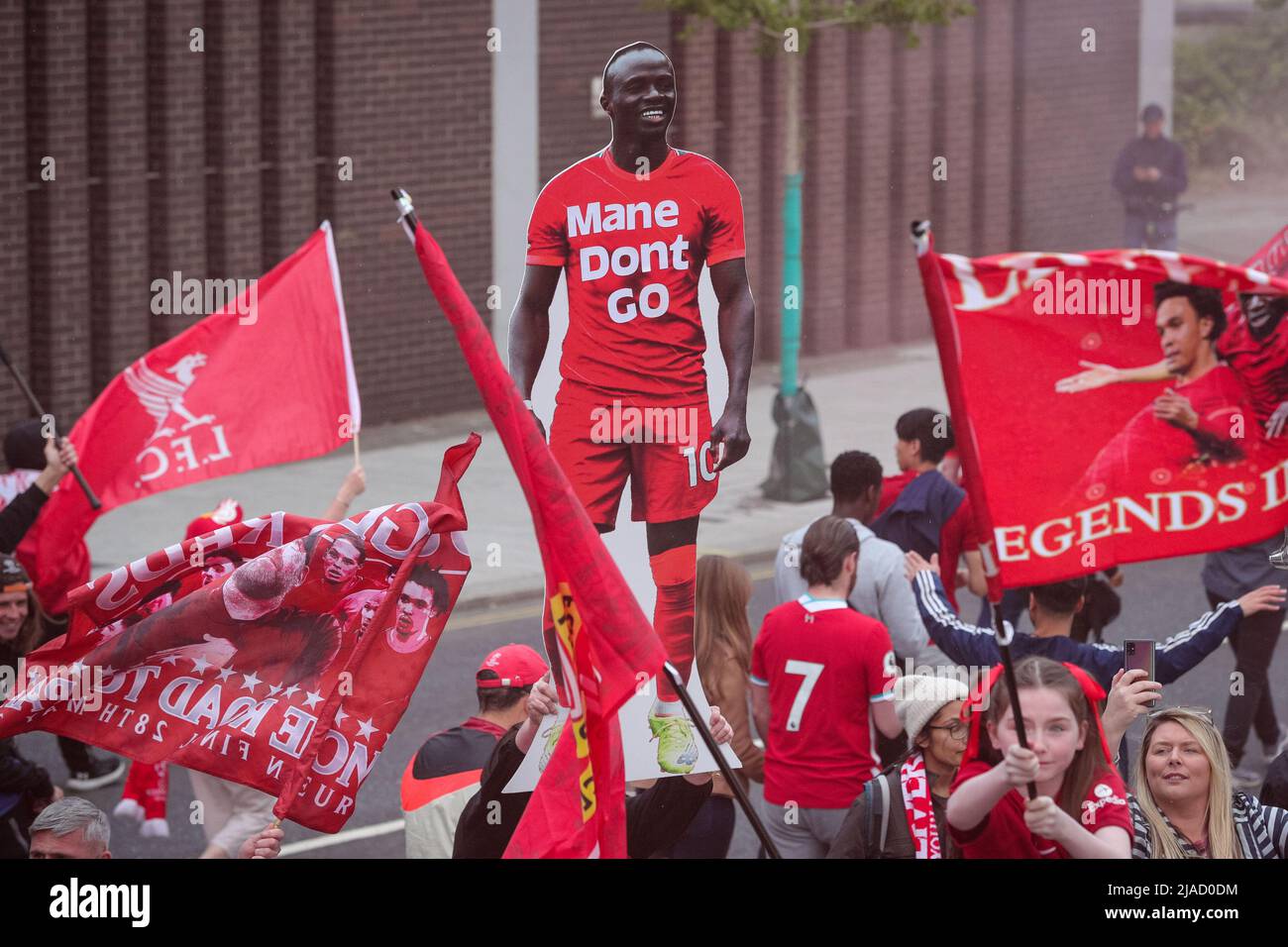 Supporters hold up a cardboard cut out of Sadio Mane asking him not to ...