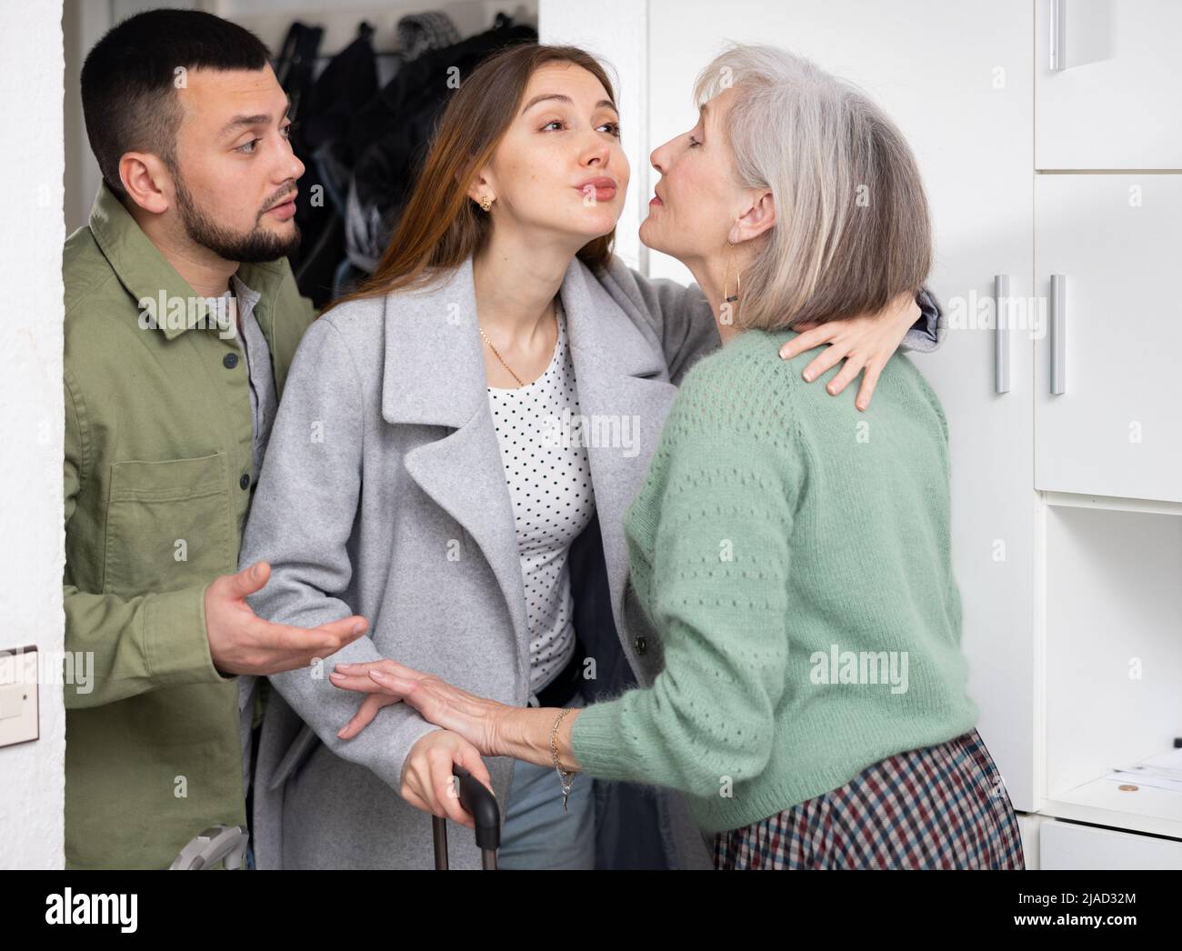 Mature woman welcoming daughter hi-res stock photography and images - Alamy