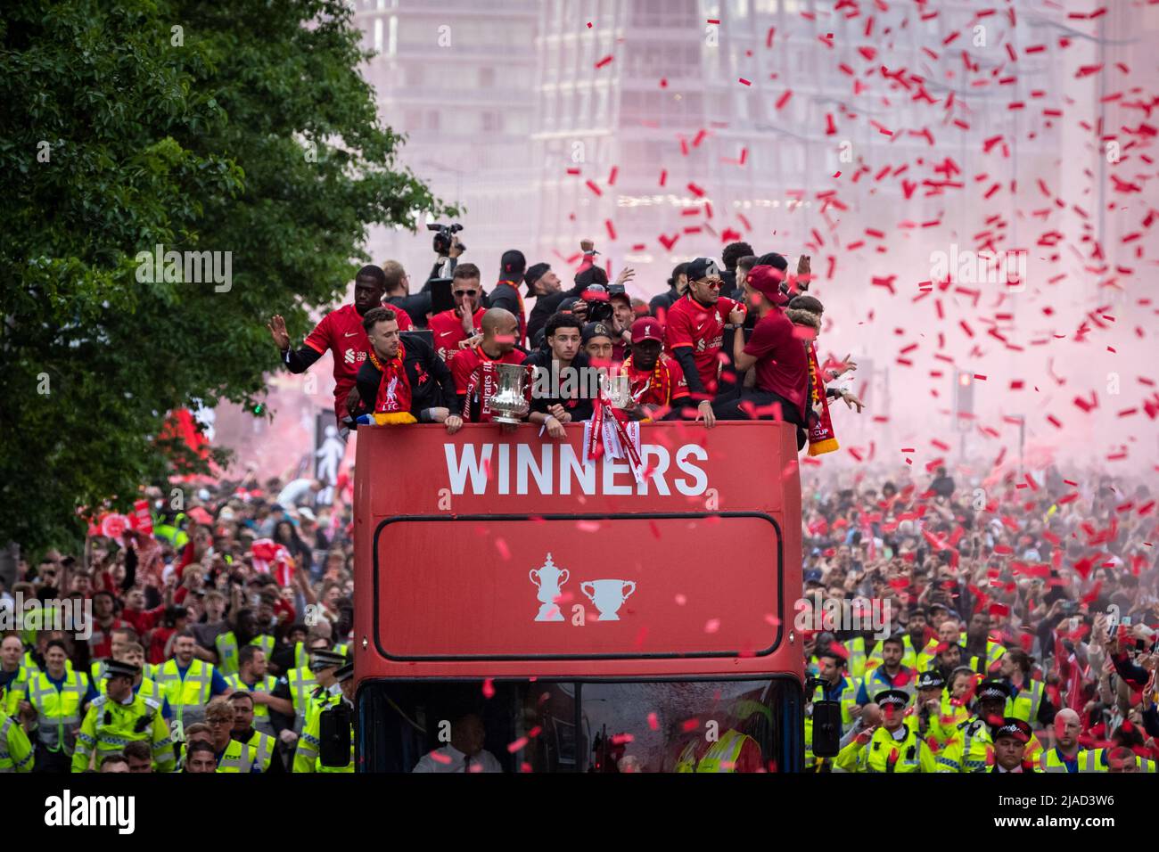 The Liverpool FC squad celebrate during the open top bus parade through ...