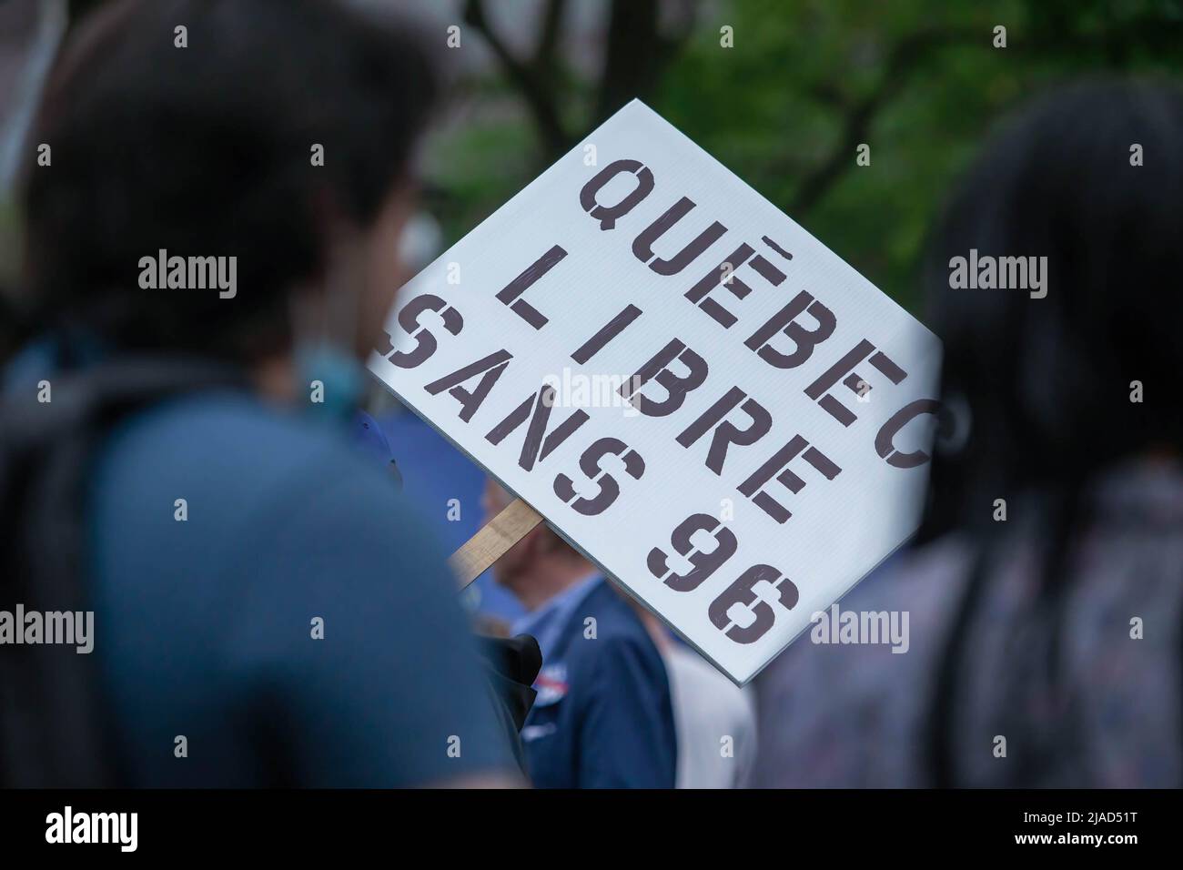 Montreal, Canada. 26th May, 2022. A protester holds a placard in French ...