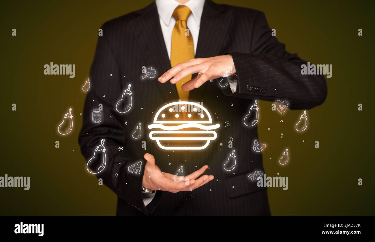 Hand holding food related icons Stock Photo - Alamy