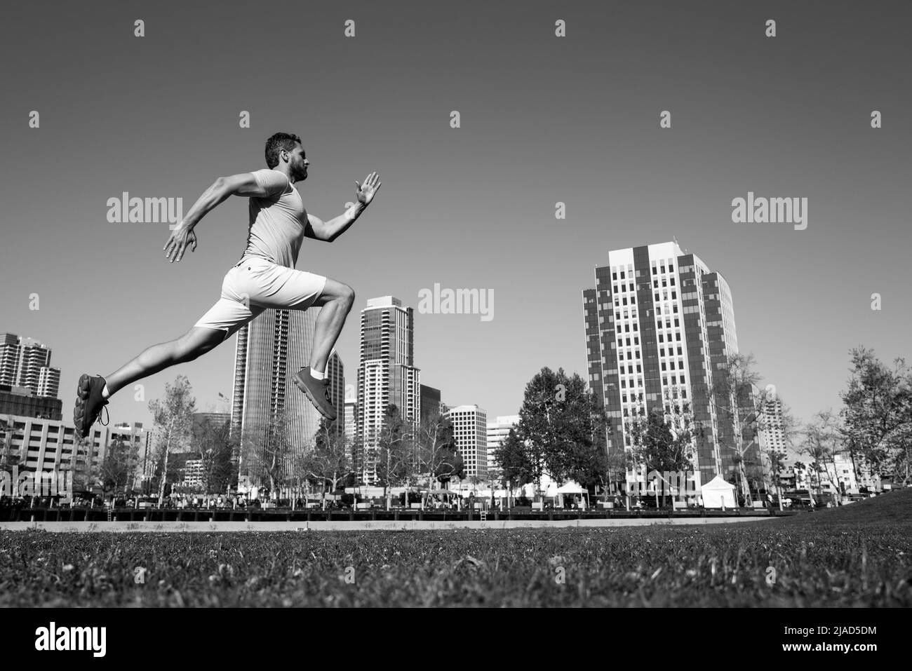 Sportsman running in middle street hi-res stock photography and images ...