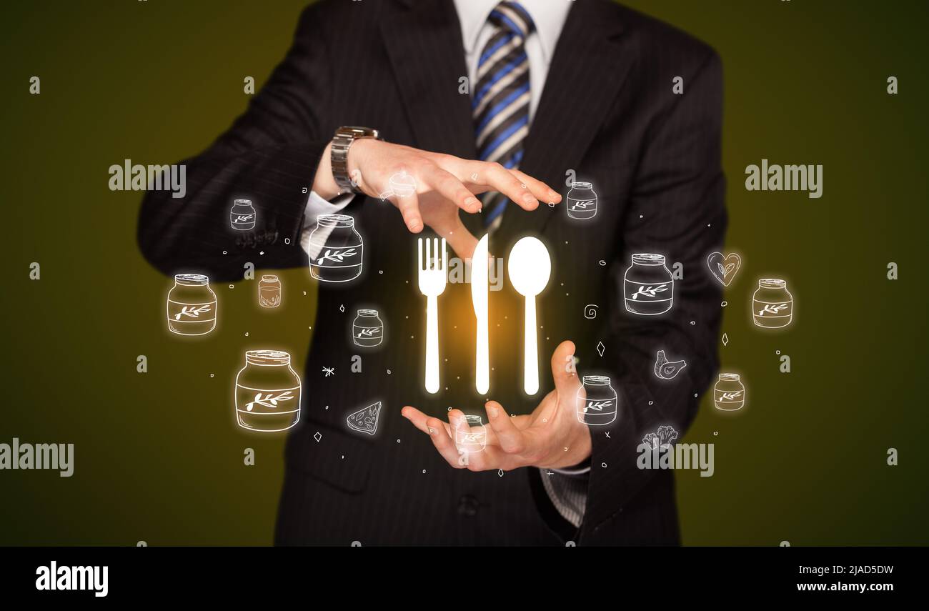 Hand holding food related icons Stock Photo - Alamy
