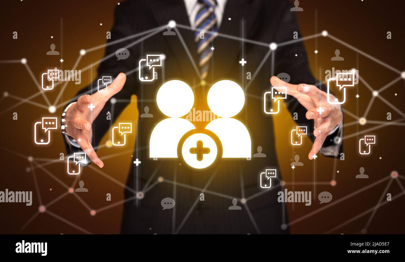 Hand holding social media icons Stock Photo - Alamy