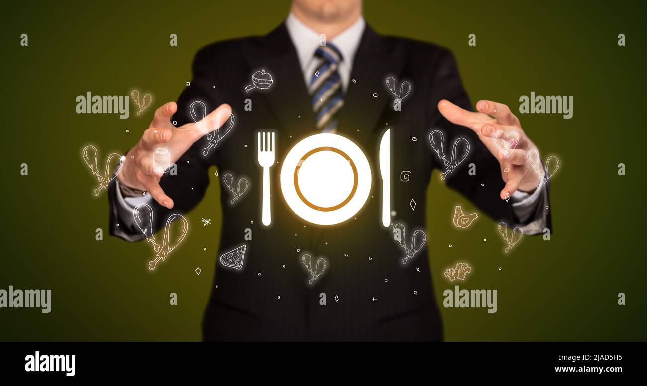 Hand holding food related icons Stock Photo - Alamy