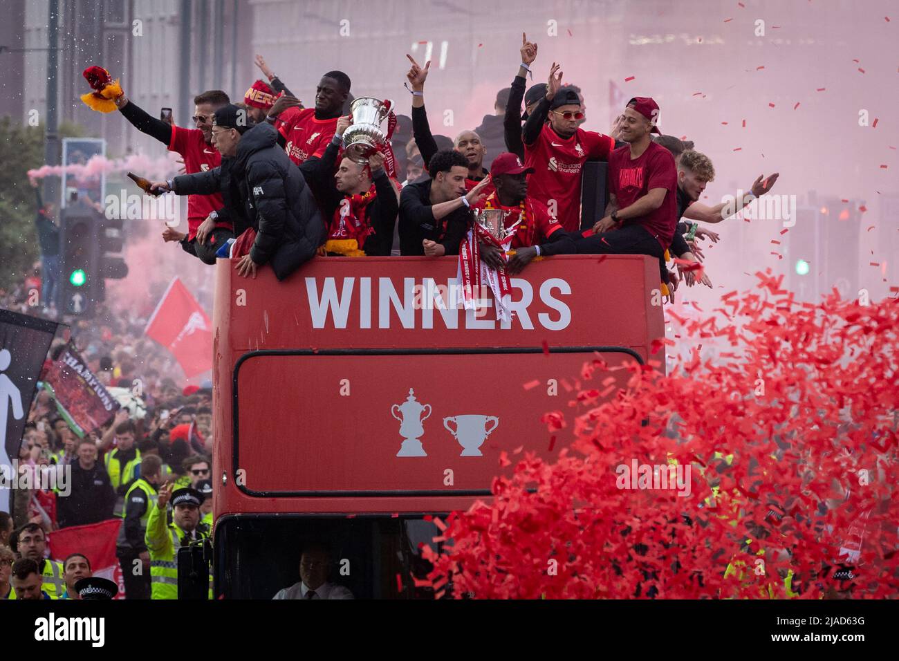 The Liverpool FC squad celebrate during the open top bus parade through ...