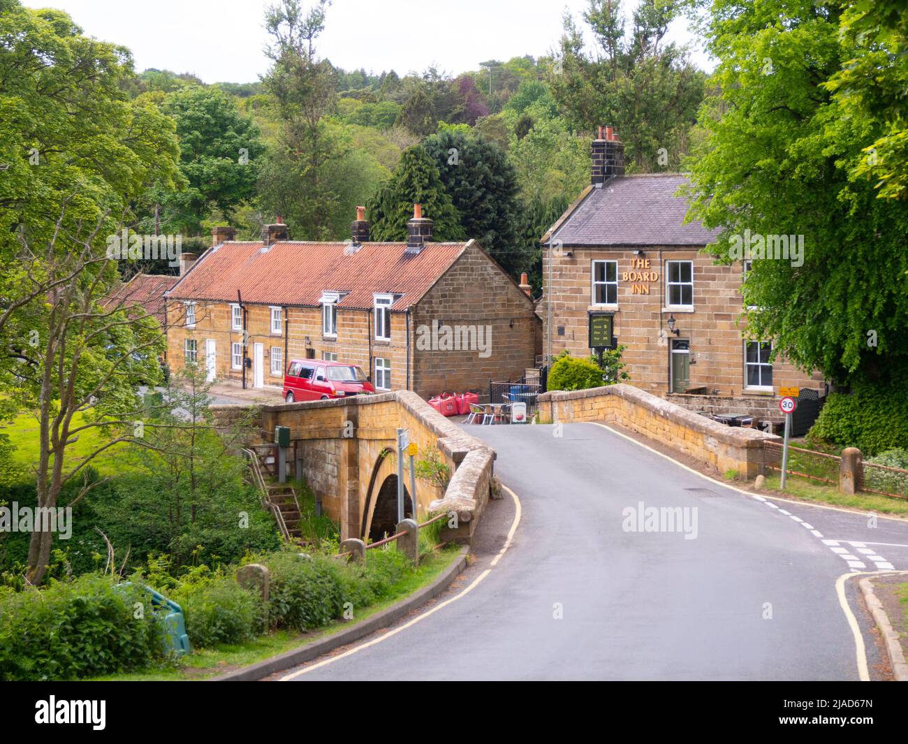 The Board Inn in Lealholm North Yorkshire viewed from across the river ...