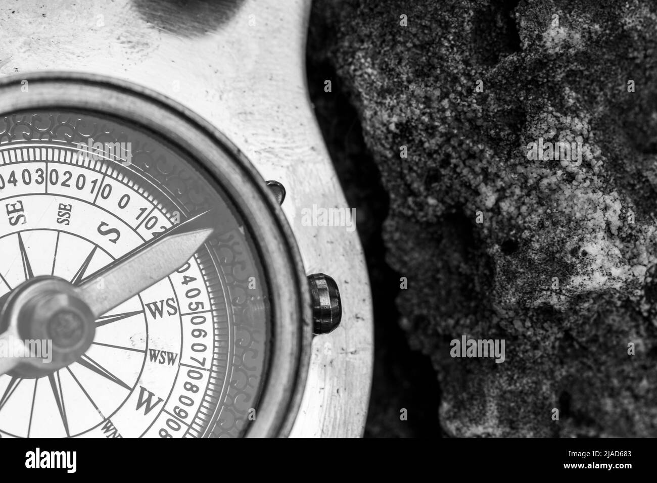 Detail of an antique maritime bronze solar compass in black and white ...