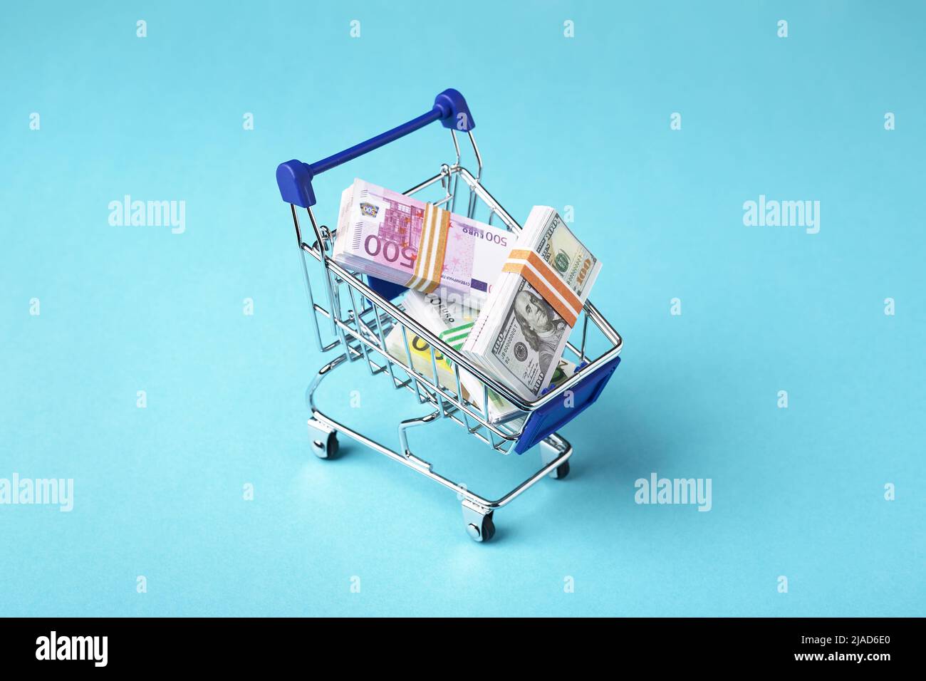Shopping cart full of money, Dollars and Euro, sales and shopping ...