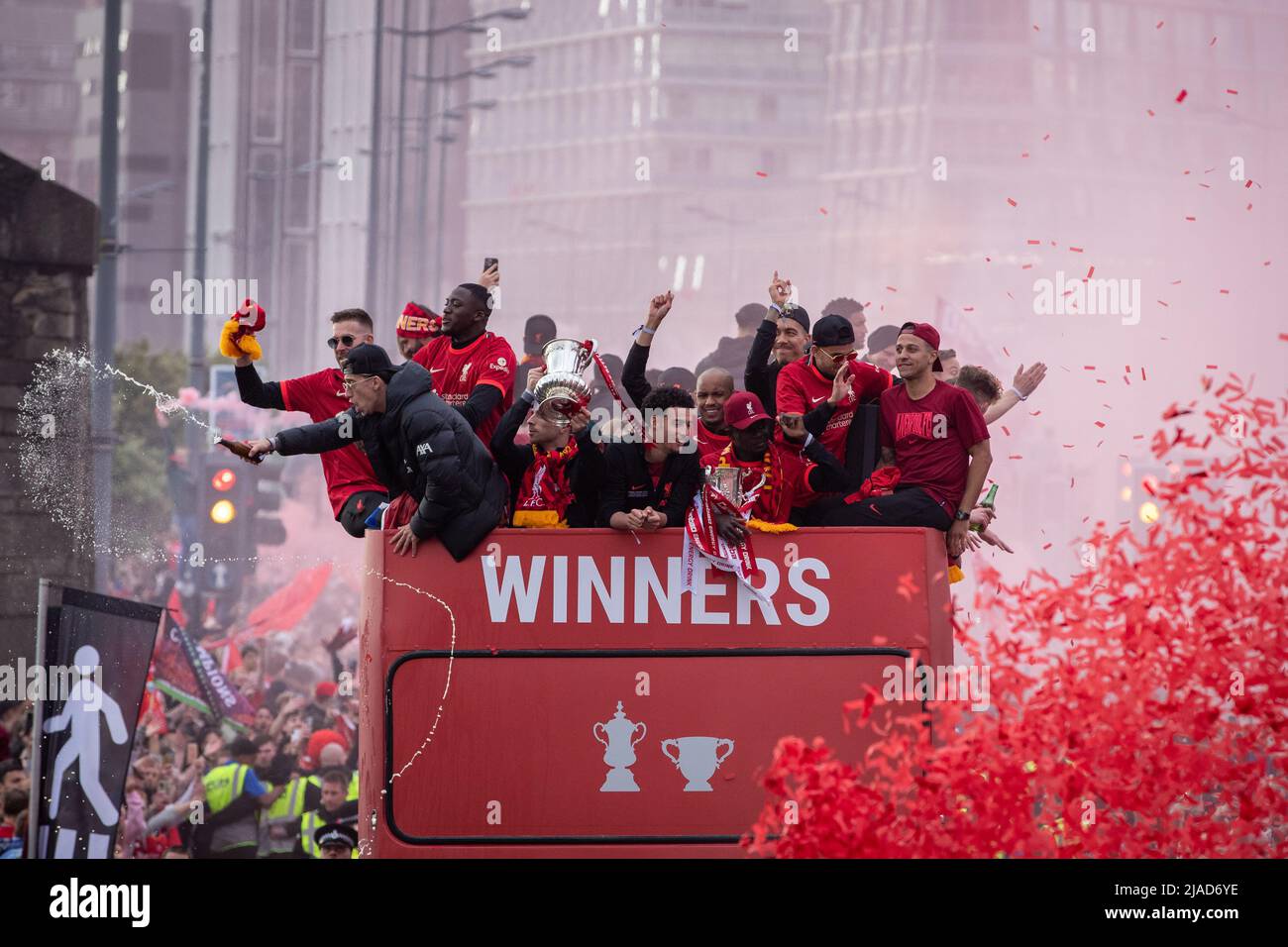 The Liverpool FC squad celebrate during the open top bus parade through ...