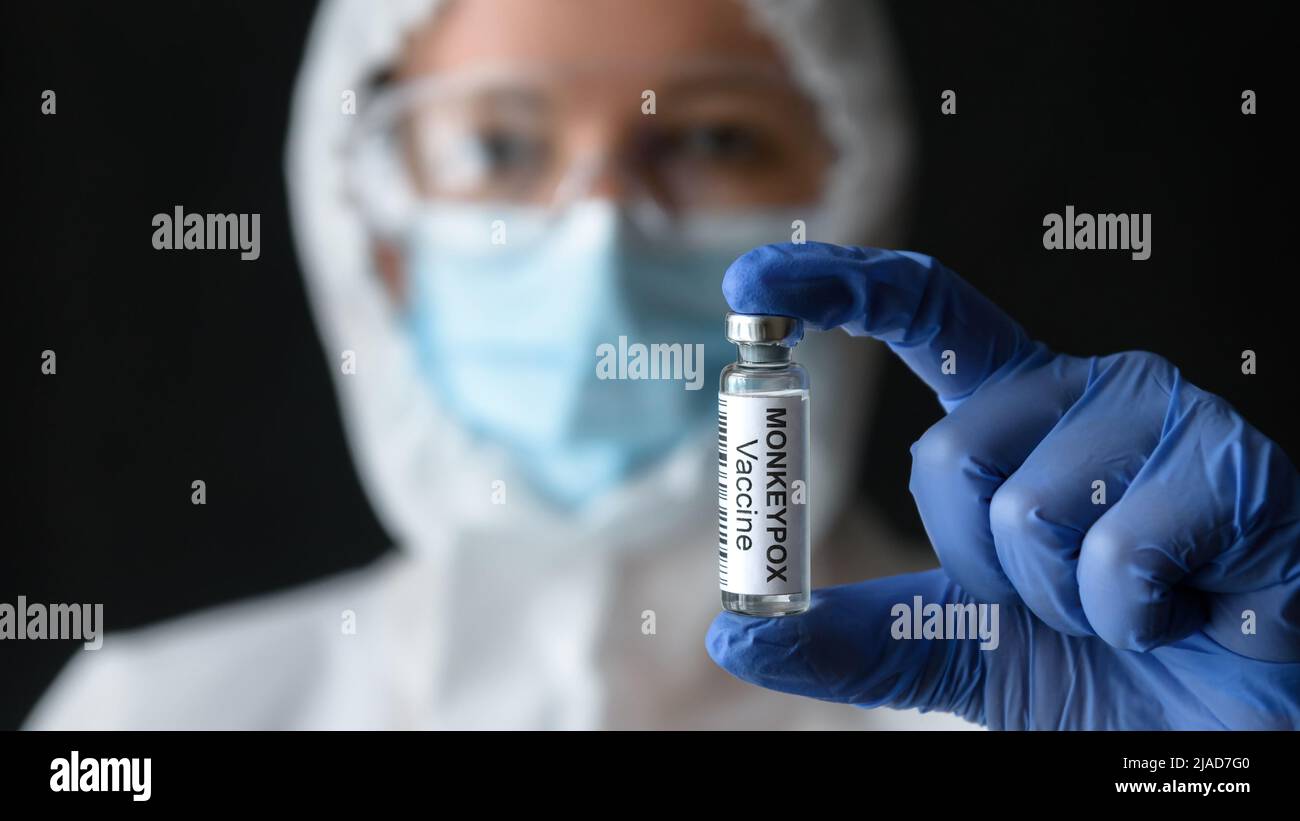 Monkeypox vaccine in doctors hand, medical female worker in personal ...