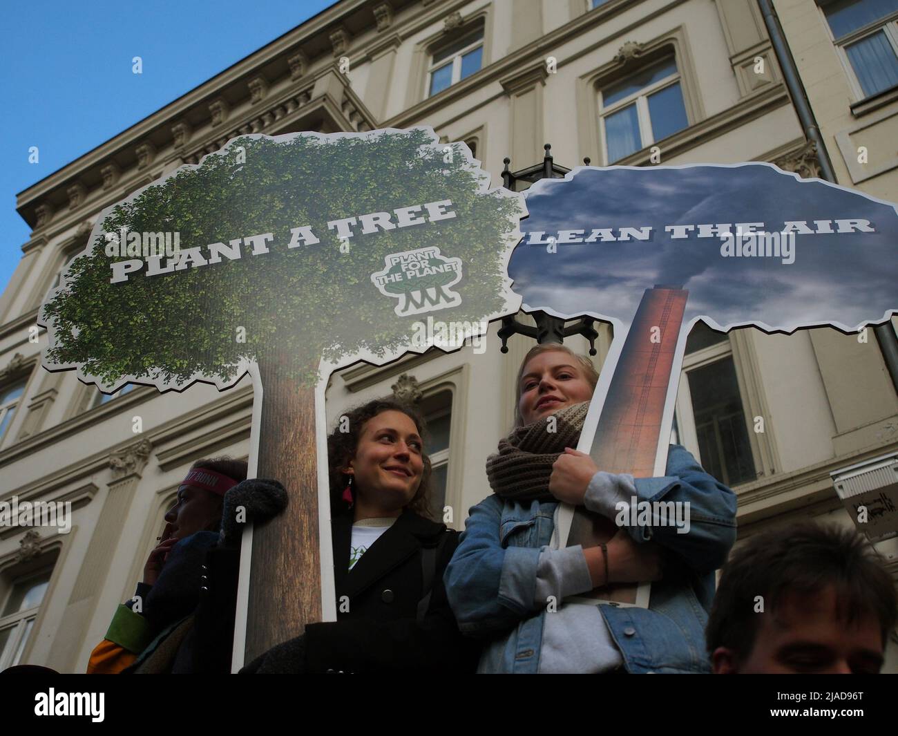 "Plant a tree" and "Clean the Air" banners. With the motto "keep coal ...
