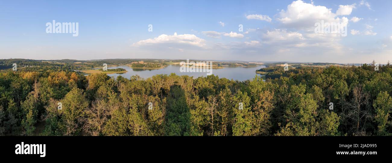 Panoramic landscape view of rolling hills, forests, and fields under ...