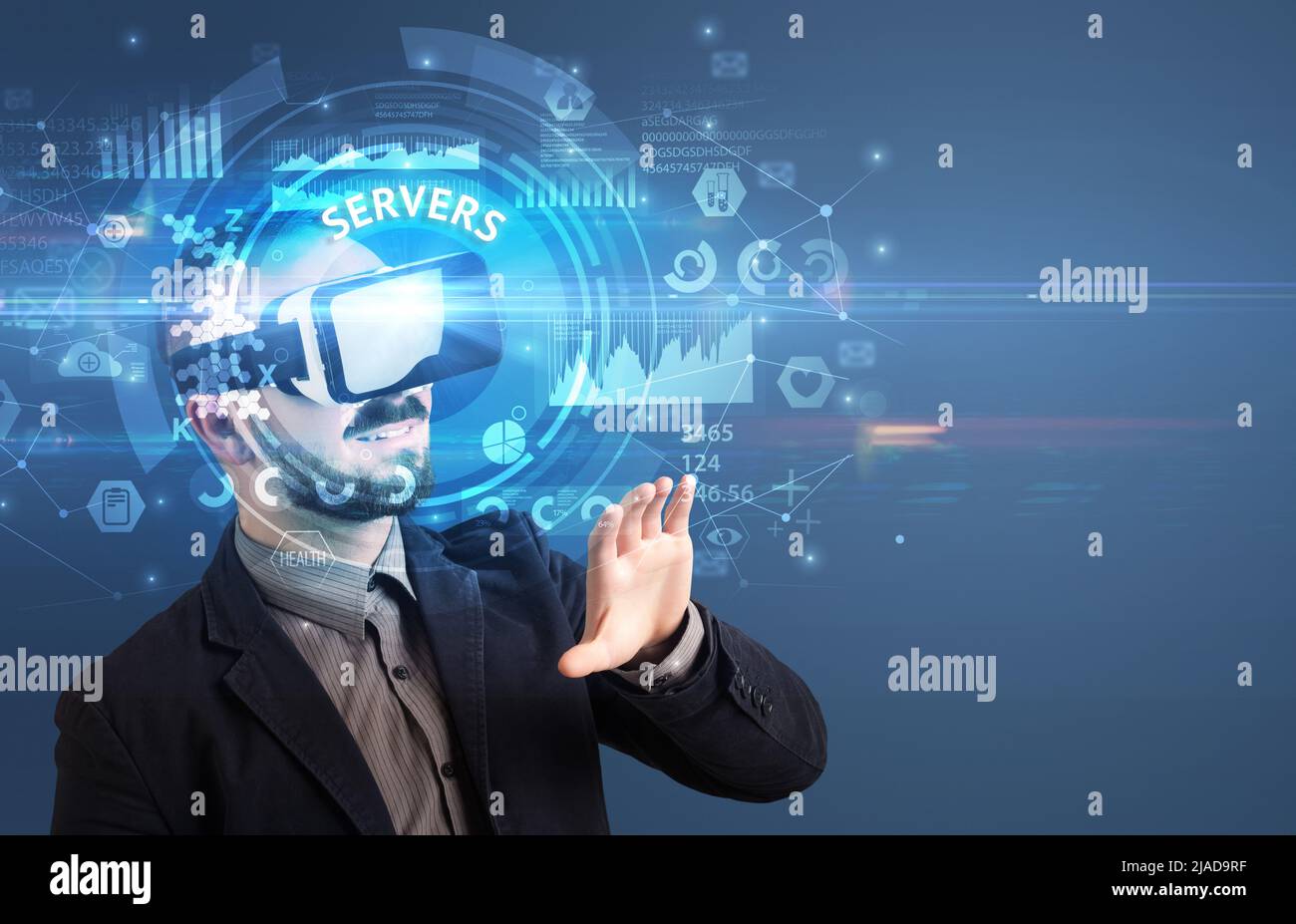 Businessman looking through VR glasses Stock Photo - Alamy