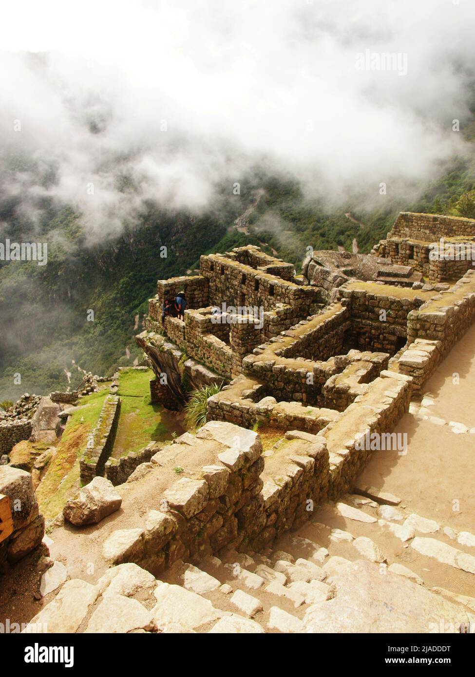 Stone Inca buildings at Machu Picchu ruins Stock Photo - Alamy