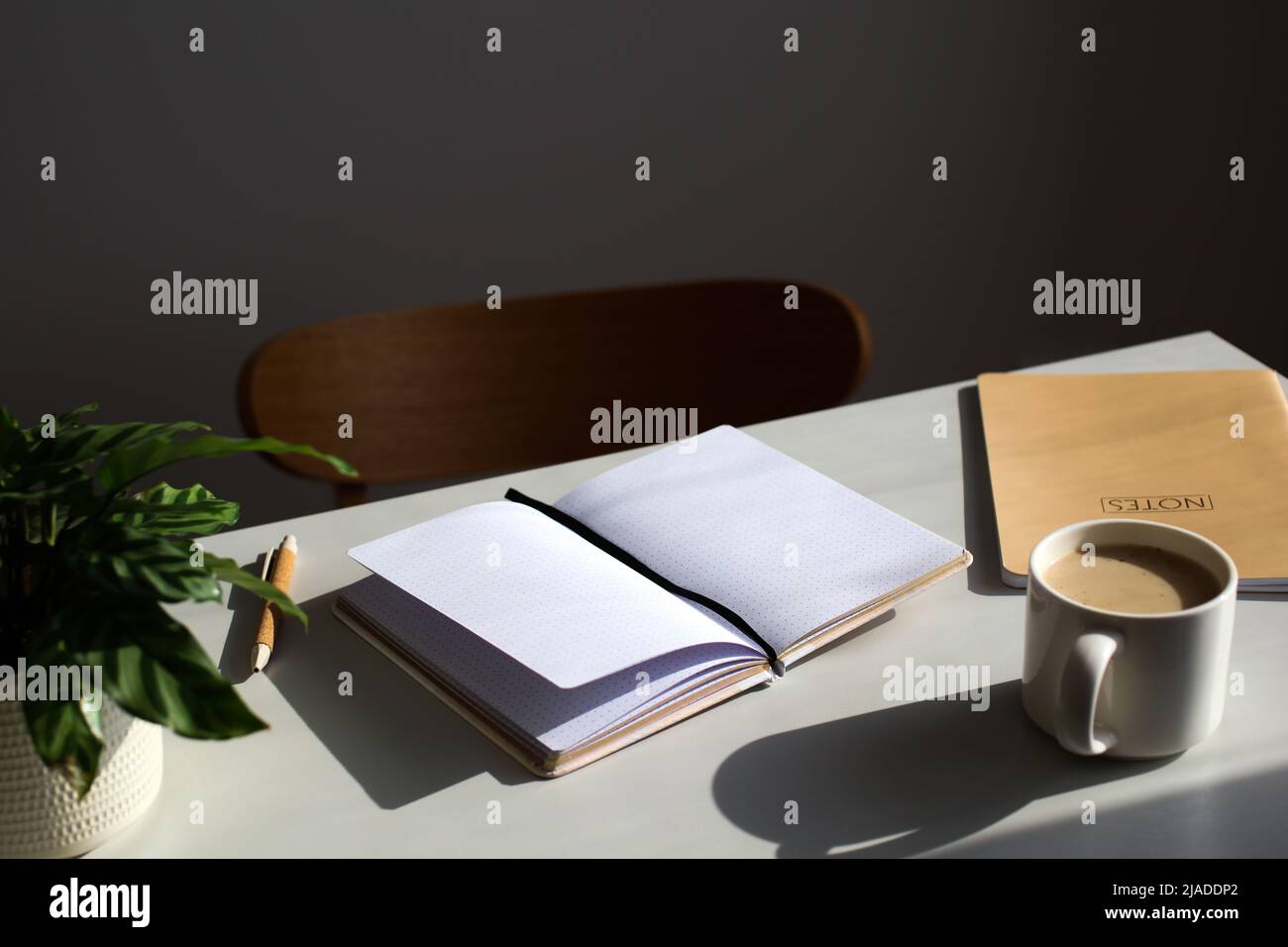 Elegant home office desk table. Feminine workspace with paper notebook ...