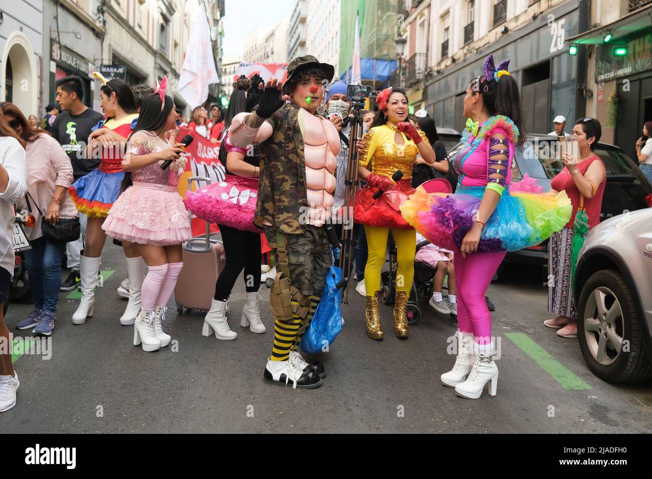 Several people of Peruvian origin dress as clowns during a parade to ...