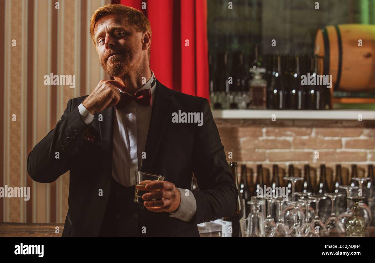 Stylish man drinking whiskey. Alcohol at bar. Man at pub Stock Photo ...