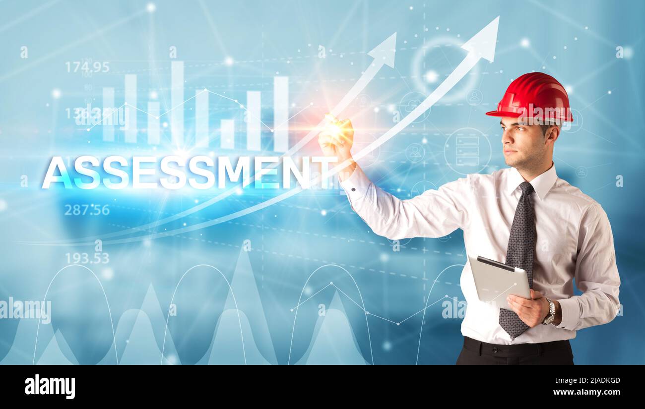 Young Businessman with helmet concept Stock Photo - Alamy