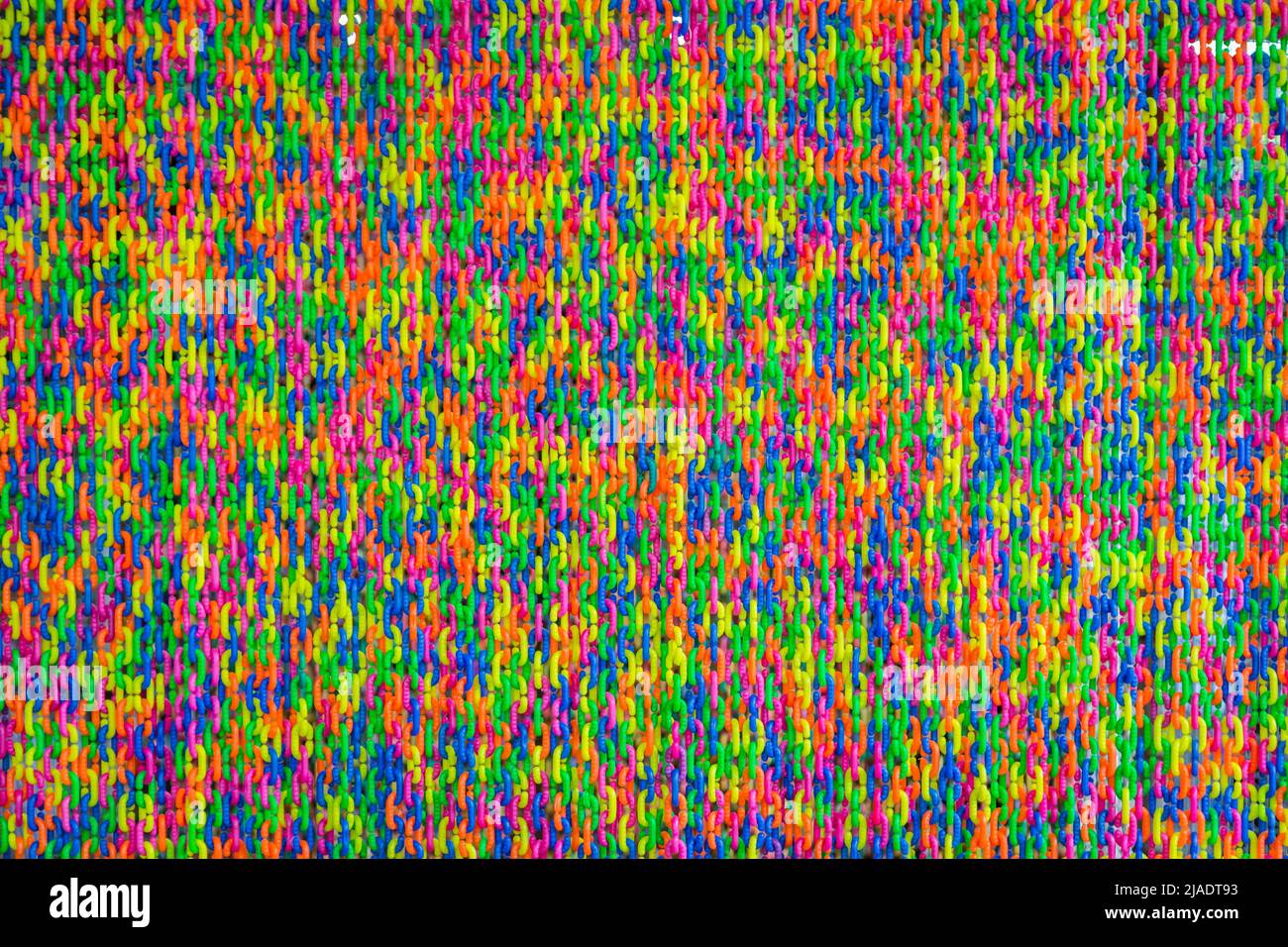 Colorful plastic chain background Stock Photo - Alamy