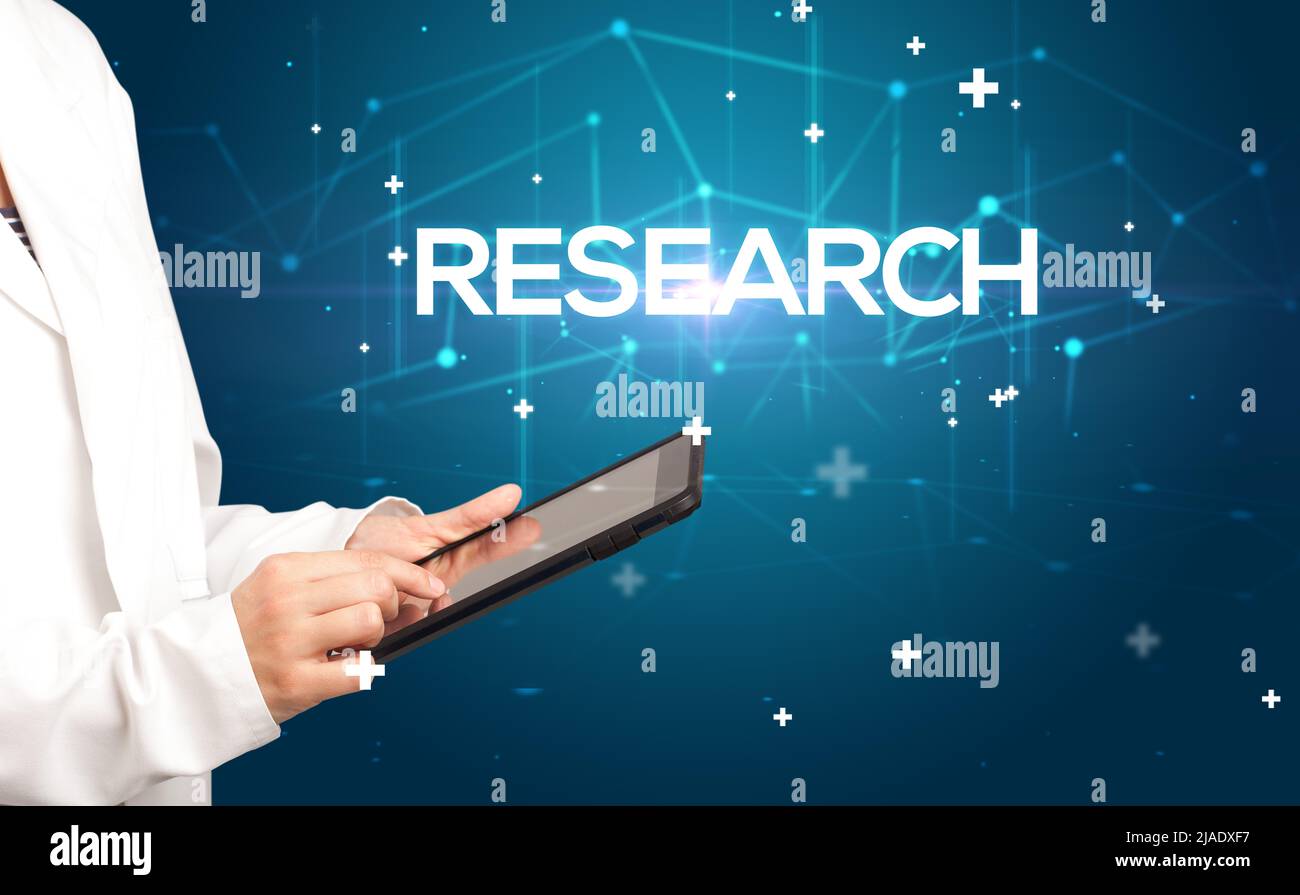 Doctor fills out medical record Stock Photo - Alamy