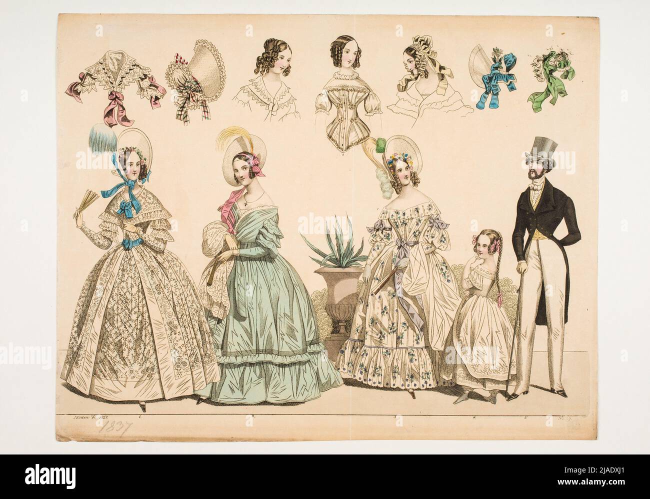 Fashion image: five figures, women's, men's and children's fashion, a ...