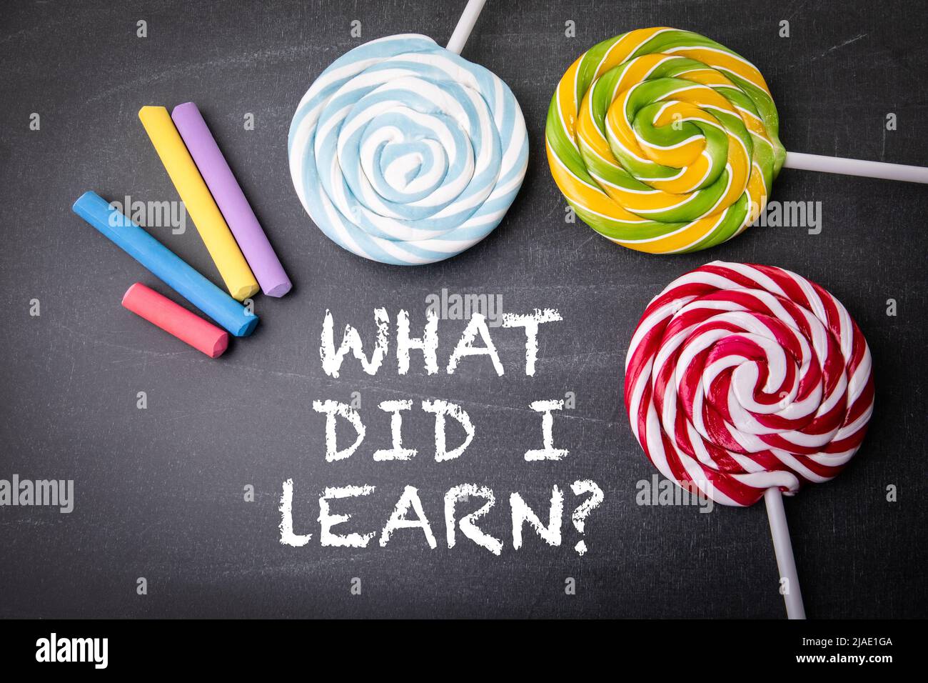 What did I learn. Text and candy on a stick on a chalk board Stock ...