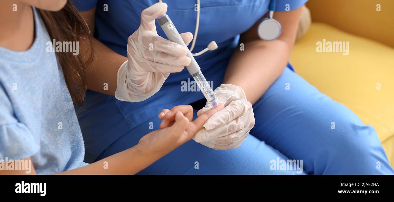 Doctor taking blood sample of little girl with diabetes, closeup Stock ...