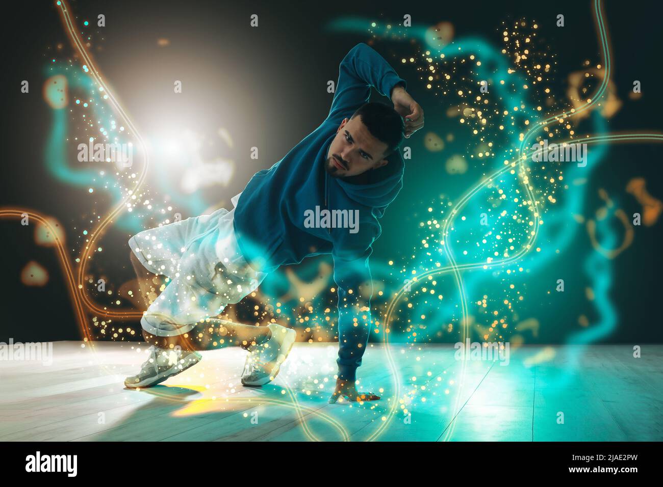 Handsome young man dancing hip-hop in studio Stock Photo - Alamy