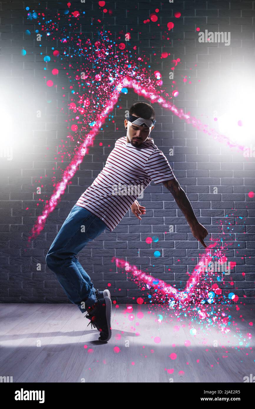 Male hip-hop dancer in modern studio Stock Photo - Alamy