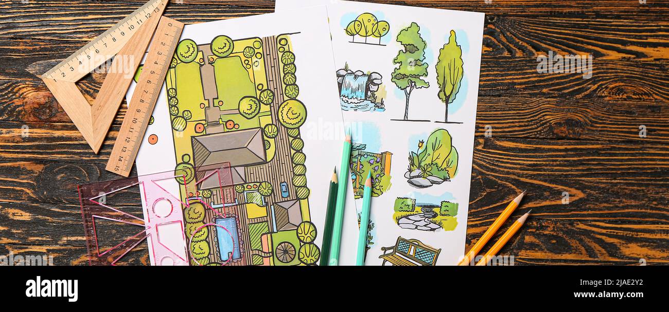Paper sheets with sketches for landscape design and stationery on ...